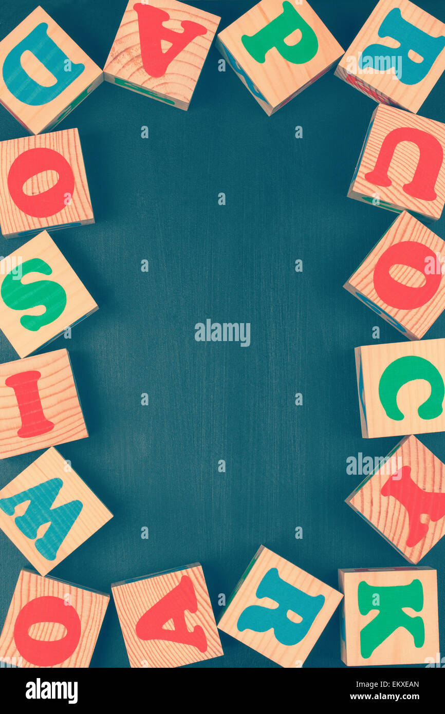 Dark background with alphabet blocks Stock Photo - Alamy