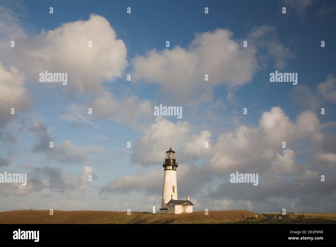 Lighthouse With Cloudy Backdrop Stock Photo - Alamy