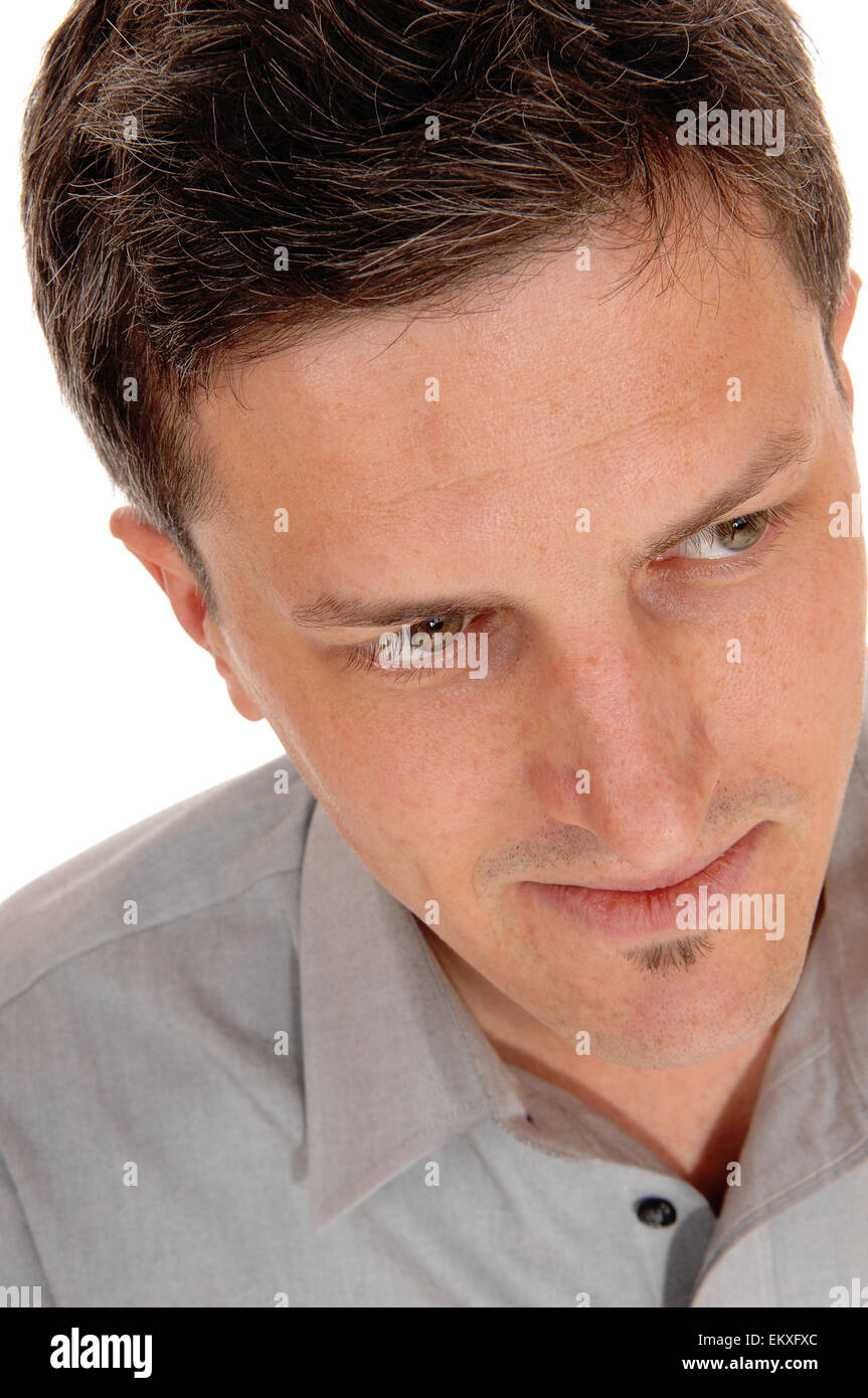 A closeup head shoot from above of a handsome young man, isolated for ...