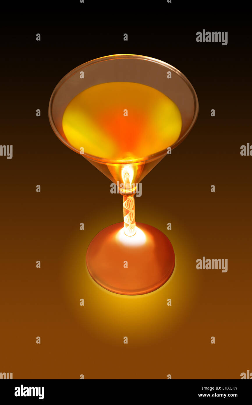 A cocktail glass which is underlit by a led light in its base stands on ...