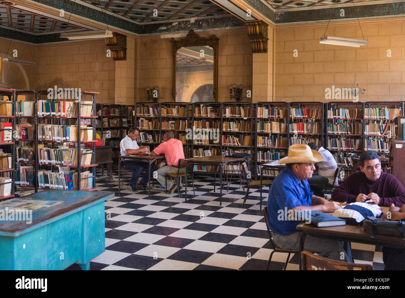 Cuba Trinidad typical library bookcases books tables chairs readers ...