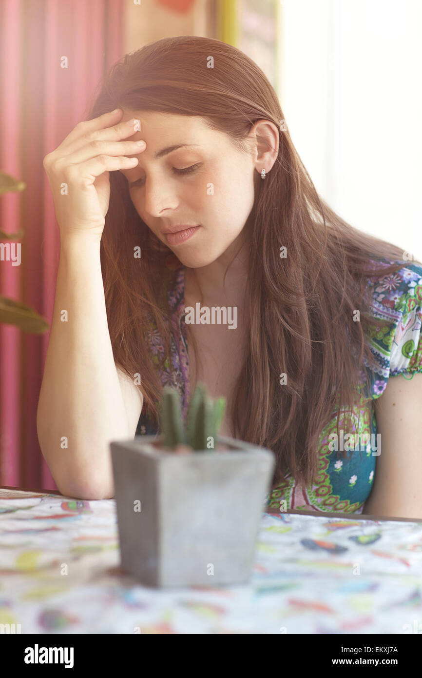 Young latin woman at street bar worried Stock Photo - Alamy