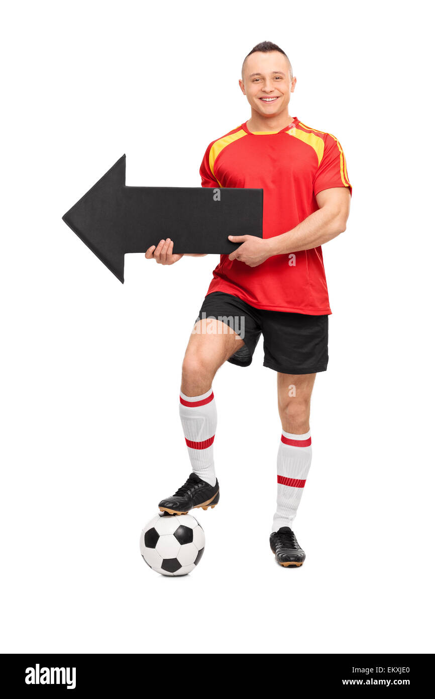 Full length portrait of a young male football player in a red jersey ...