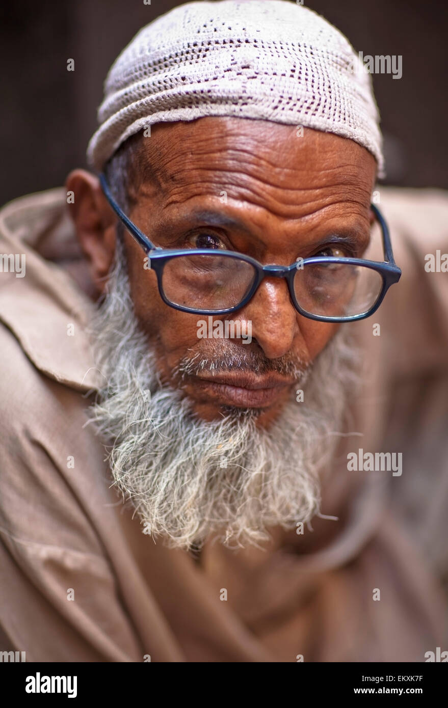 Portrait Of A Man Wearing A Prayer Cap And Eyeglasses; Delhi India ...