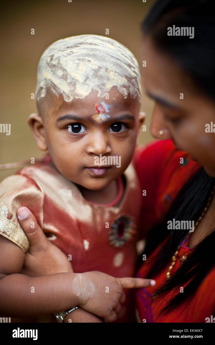 A Baby With White Paint All Over Their Head; Penang Malaysia Stock ...