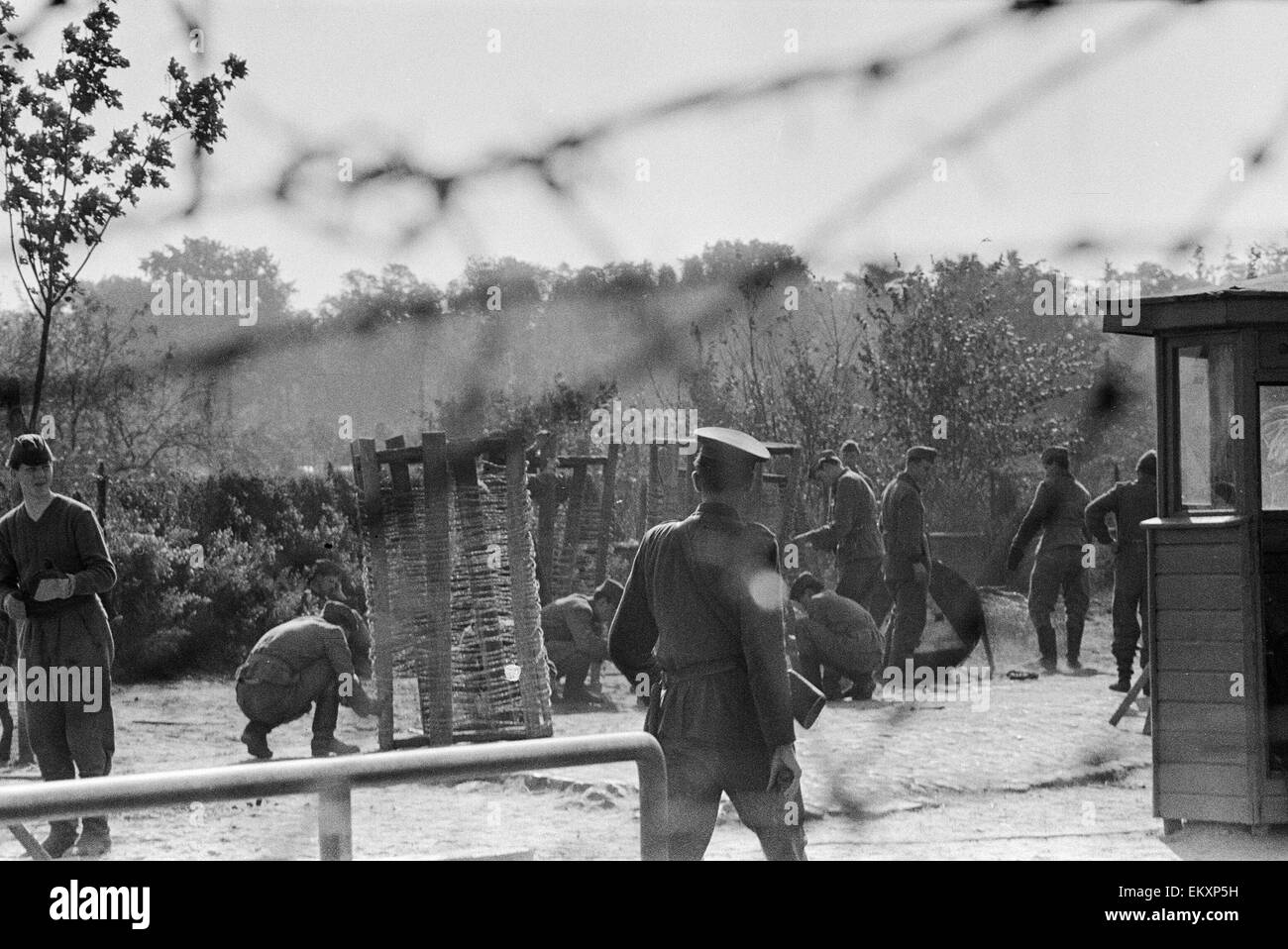 Views of the Berlin Wall with soldiers patrolling. October 1961 Stock ...