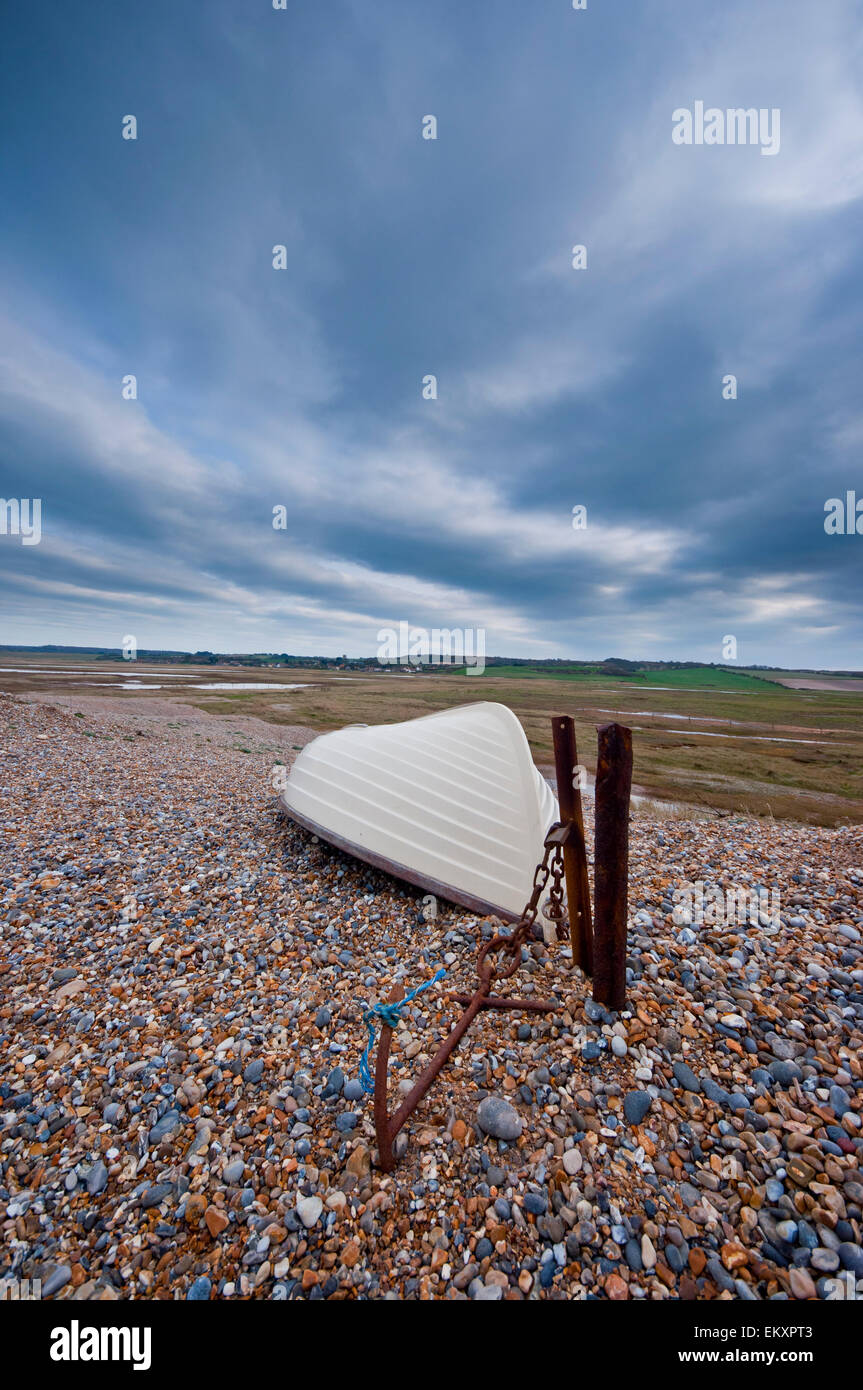 Small rowing boat shingle beach Stock Photo - Alamy