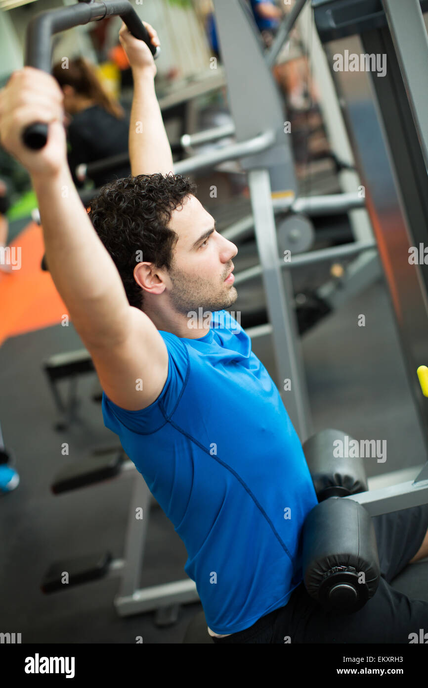 Young man training in the gym Stock Photo - Alamy