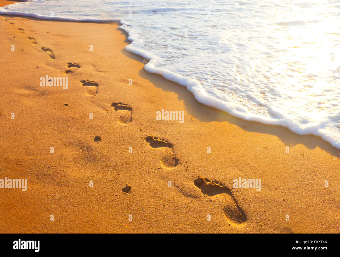 footsteps of one-legged people at sunset time Stock Photo - Alamy