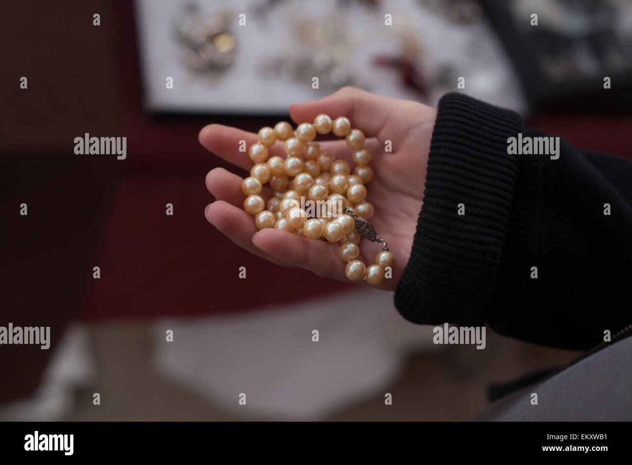 Vintage antique pearls in hand Stock Photo - Alamy