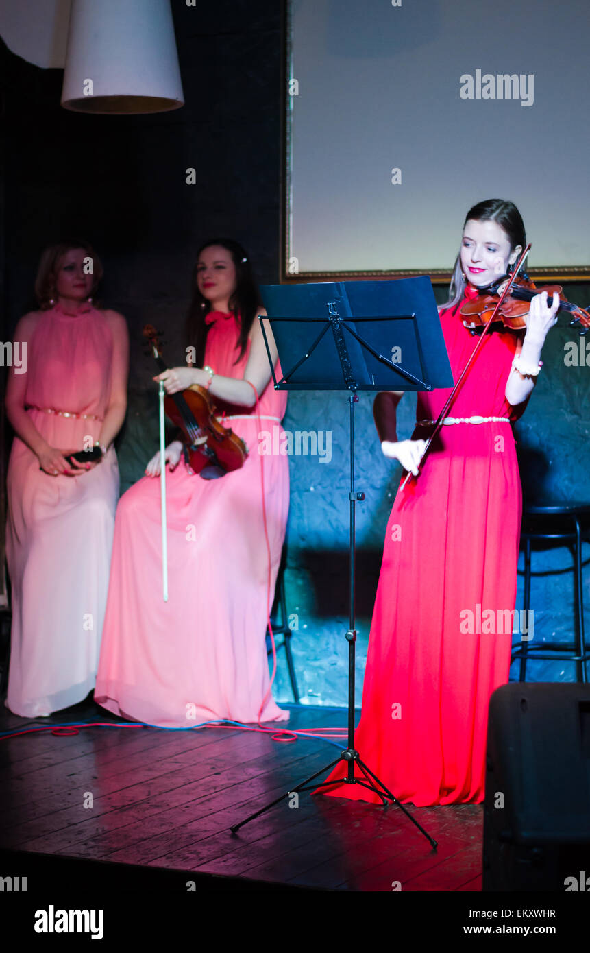 Girl playing violin pink dress High Resolution Stock Photography and ...