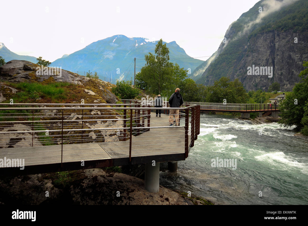 Tourists along a riverwalk, Geiranger, Norway, Scandinavia, Europe ...