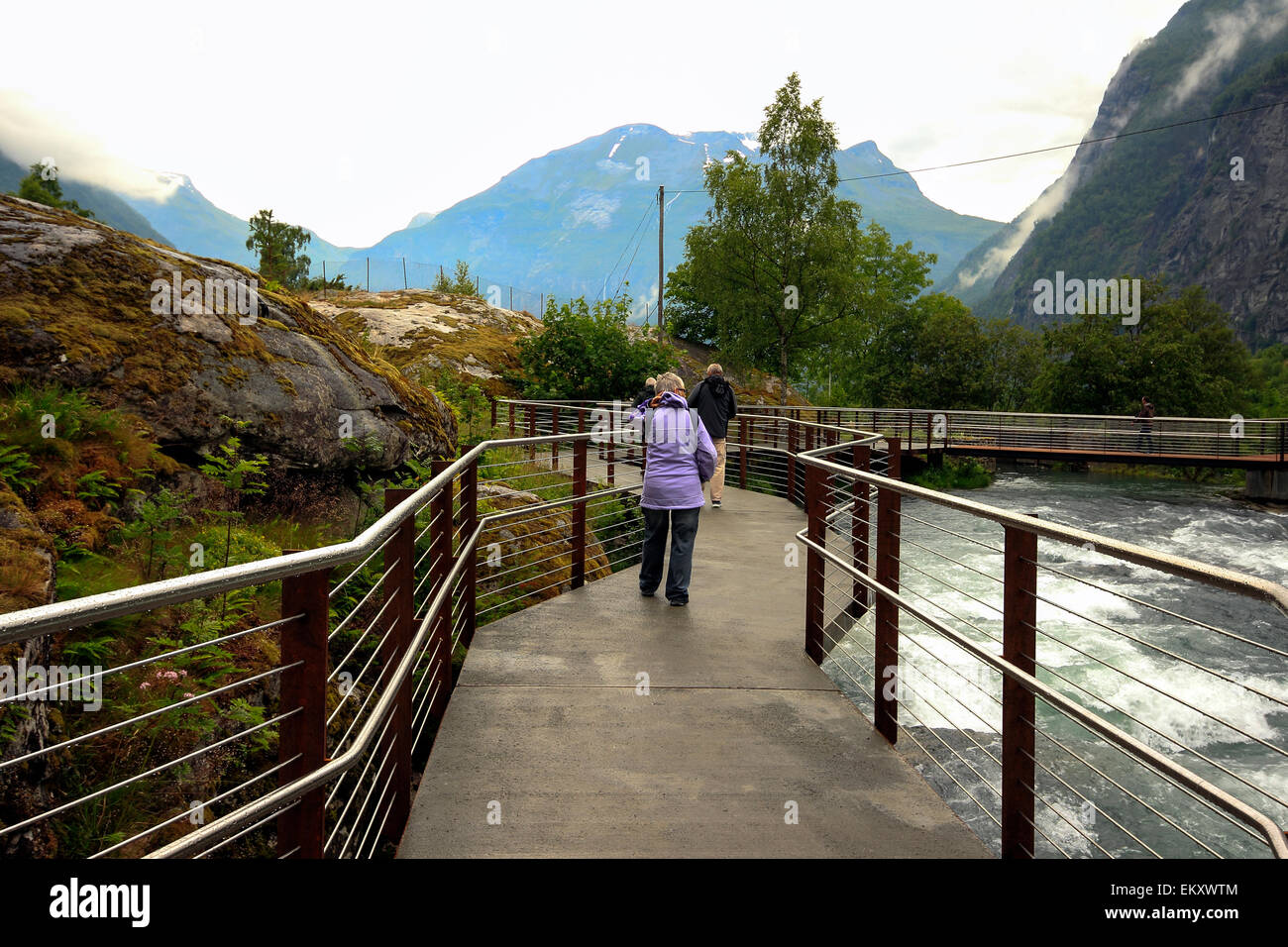 Tourists along a riverwalk, Geiranger, Norway, Scandinavia, Europe ...