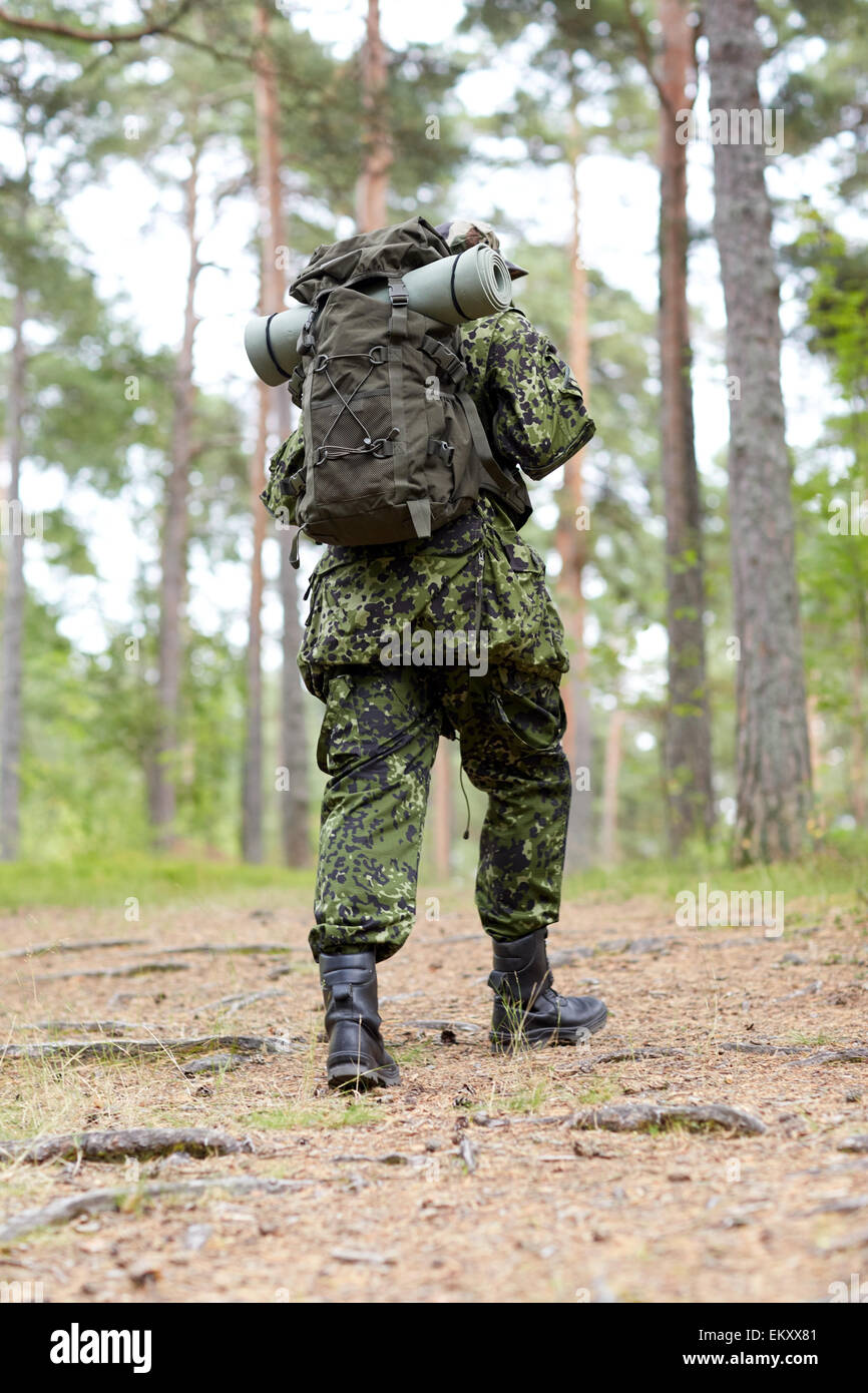 young soldier with backpack in forest Stock Photo - Alamy