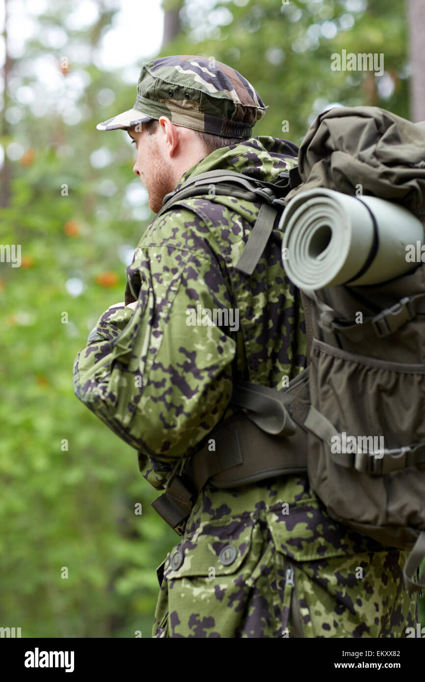 young soldier with backpack in forest Stock Photo - Alamy