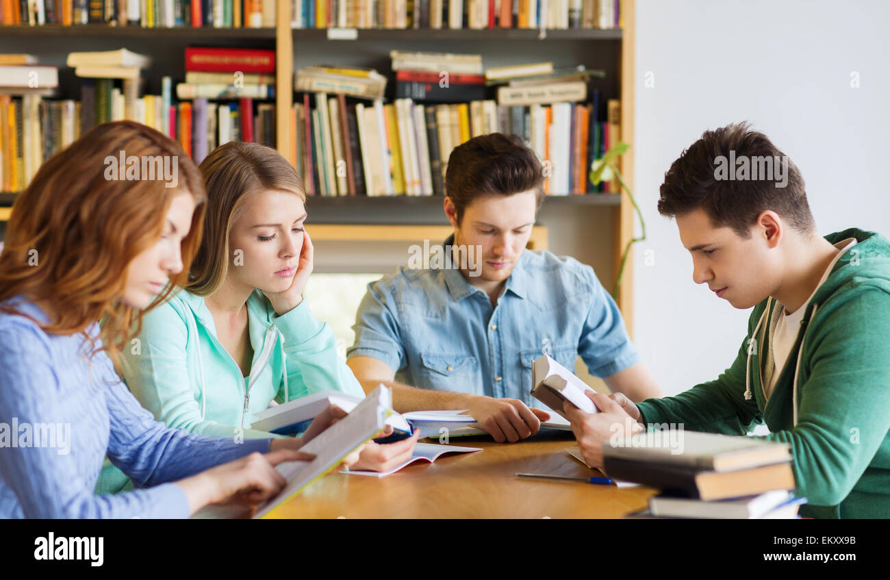 students with books preparing to exam in library Stock Photo - Alamy