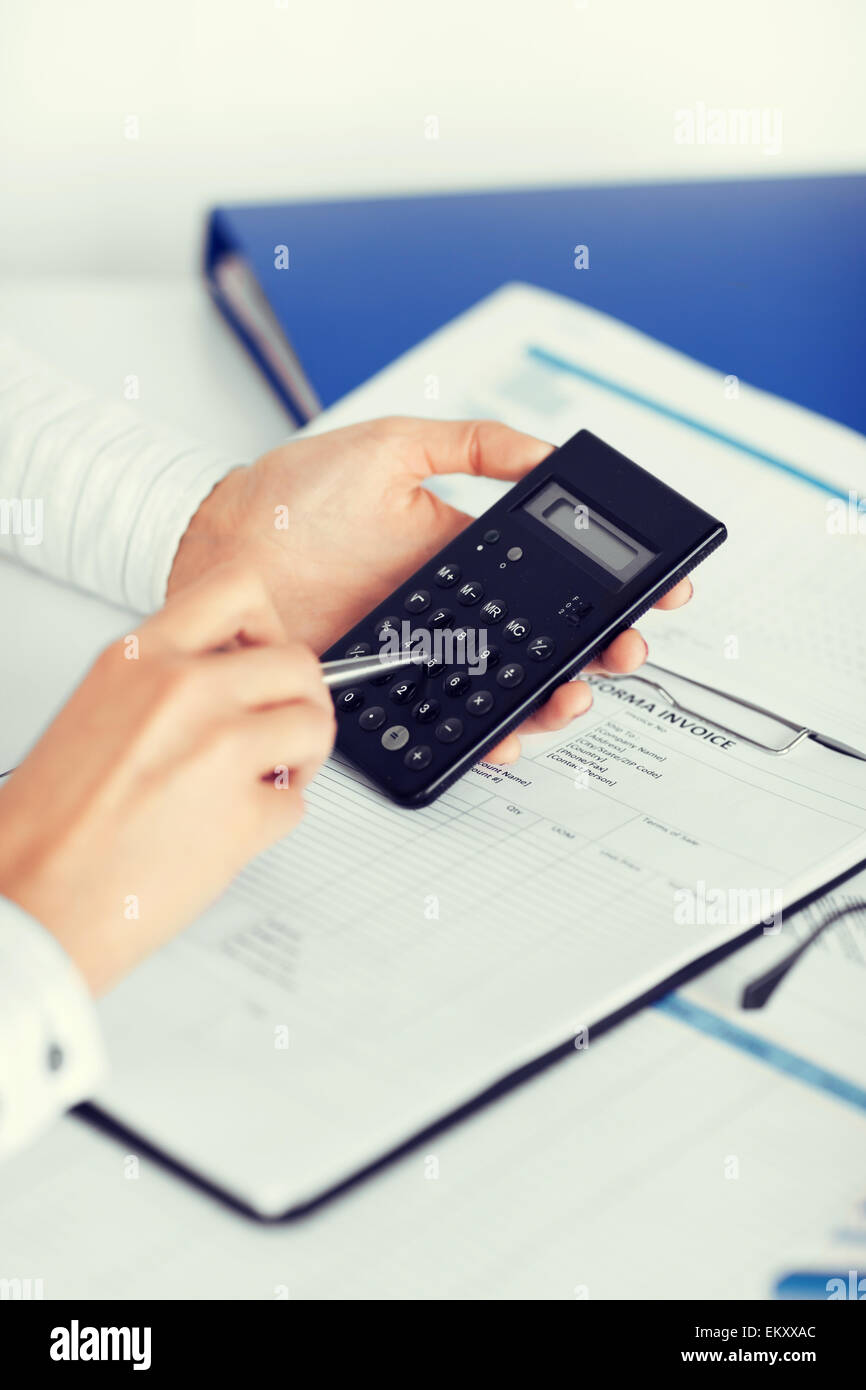 woman hand with calculator and papers Stock Photo - Alamy