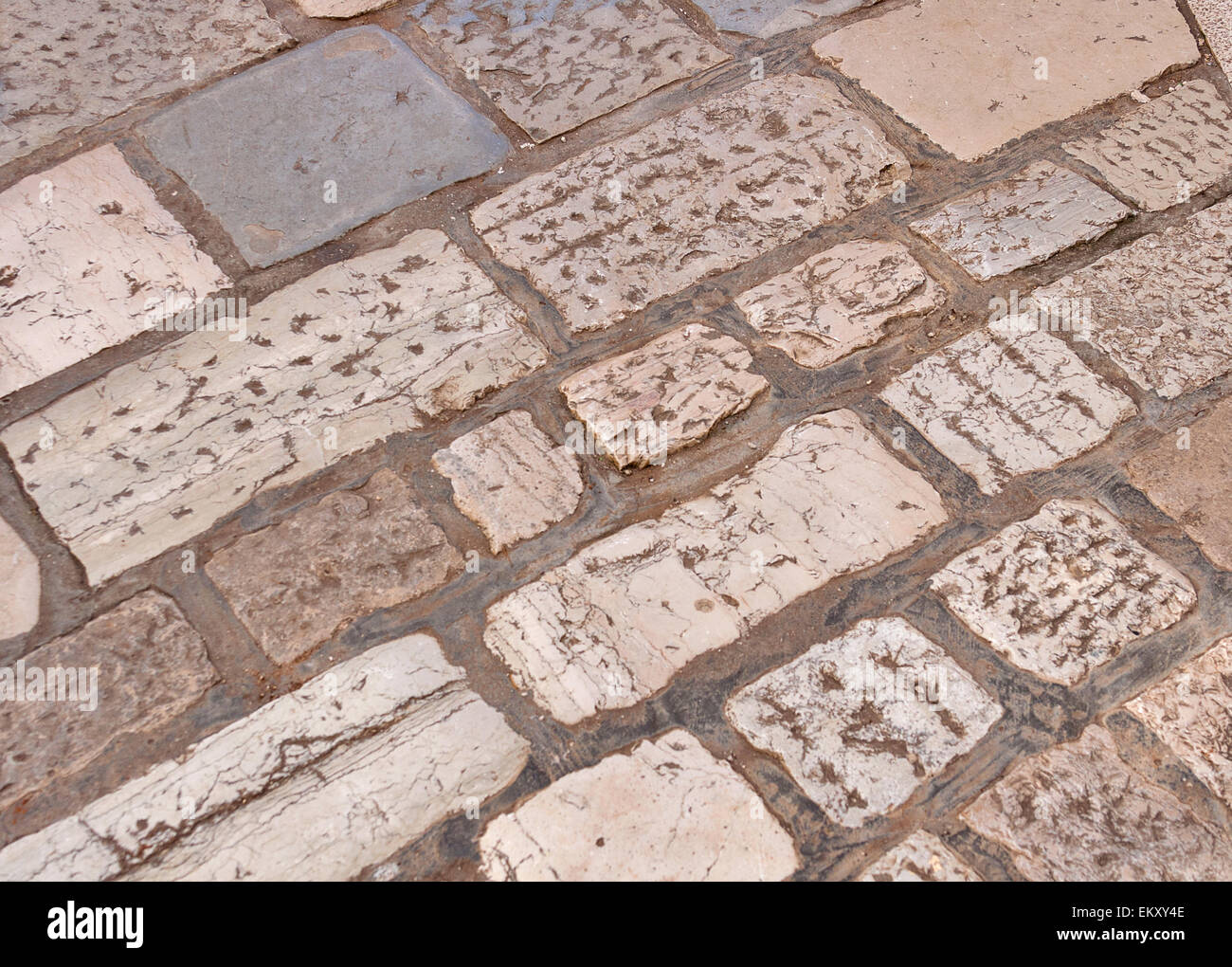 Old road tile background closeup Stock Photo - Alamy