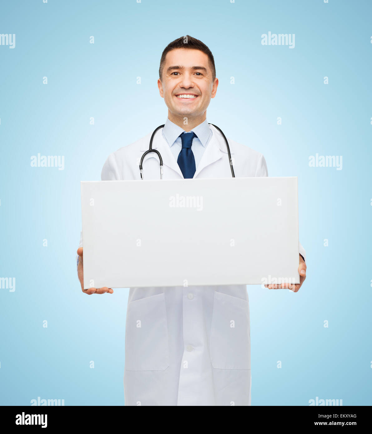 smiling male doctor holding white blank board Stock Photo - Alamy