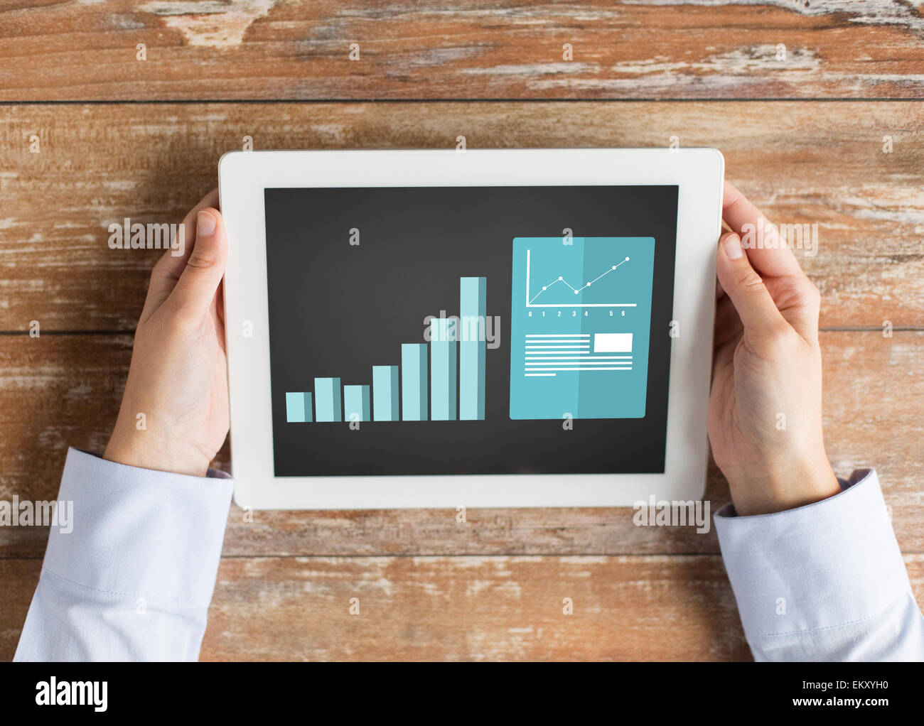 Businessman holding tablet business charts hi-res stock photography and ...