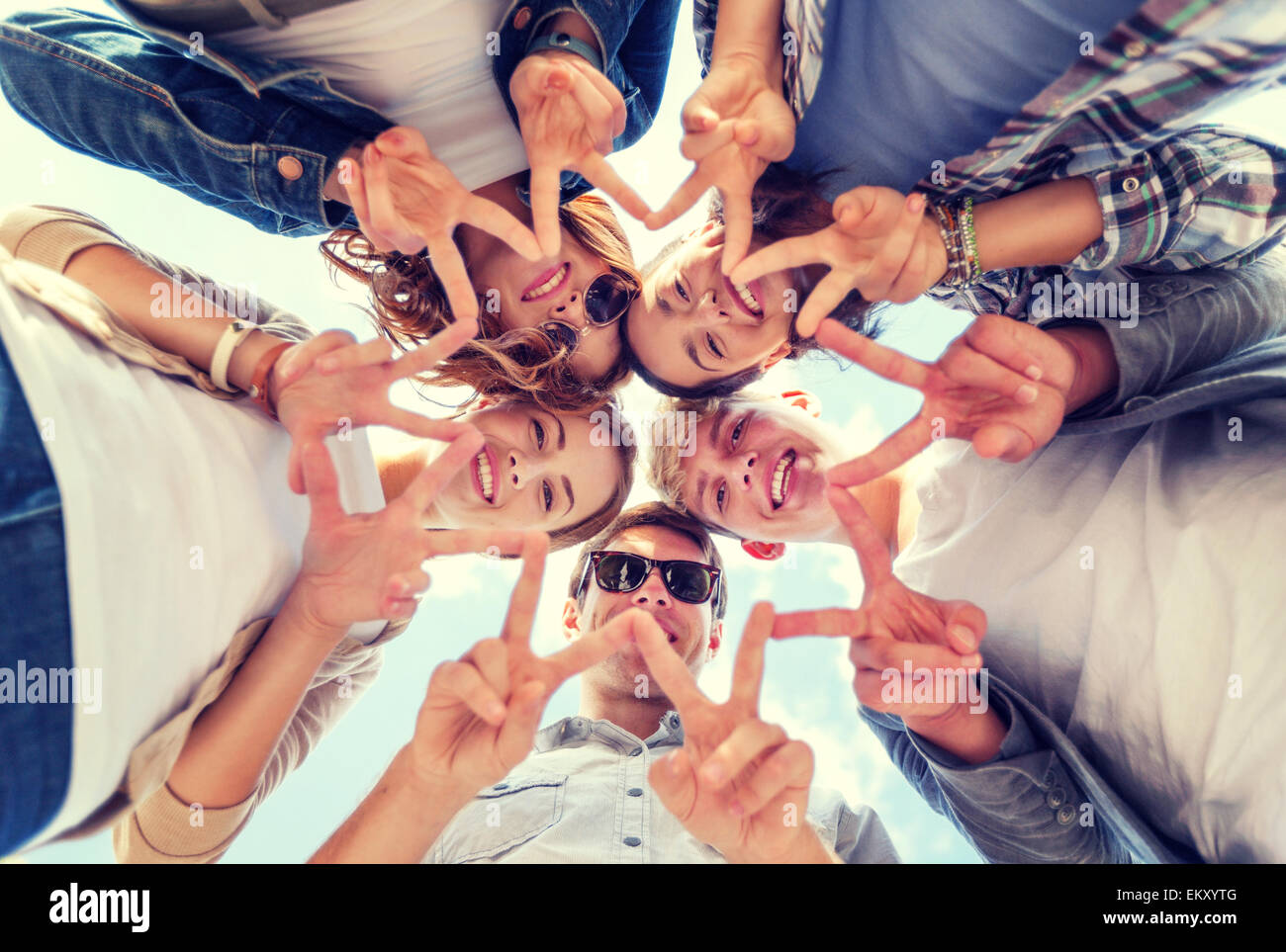 group of teenagers showing finger five Stock Photo - Alamy
