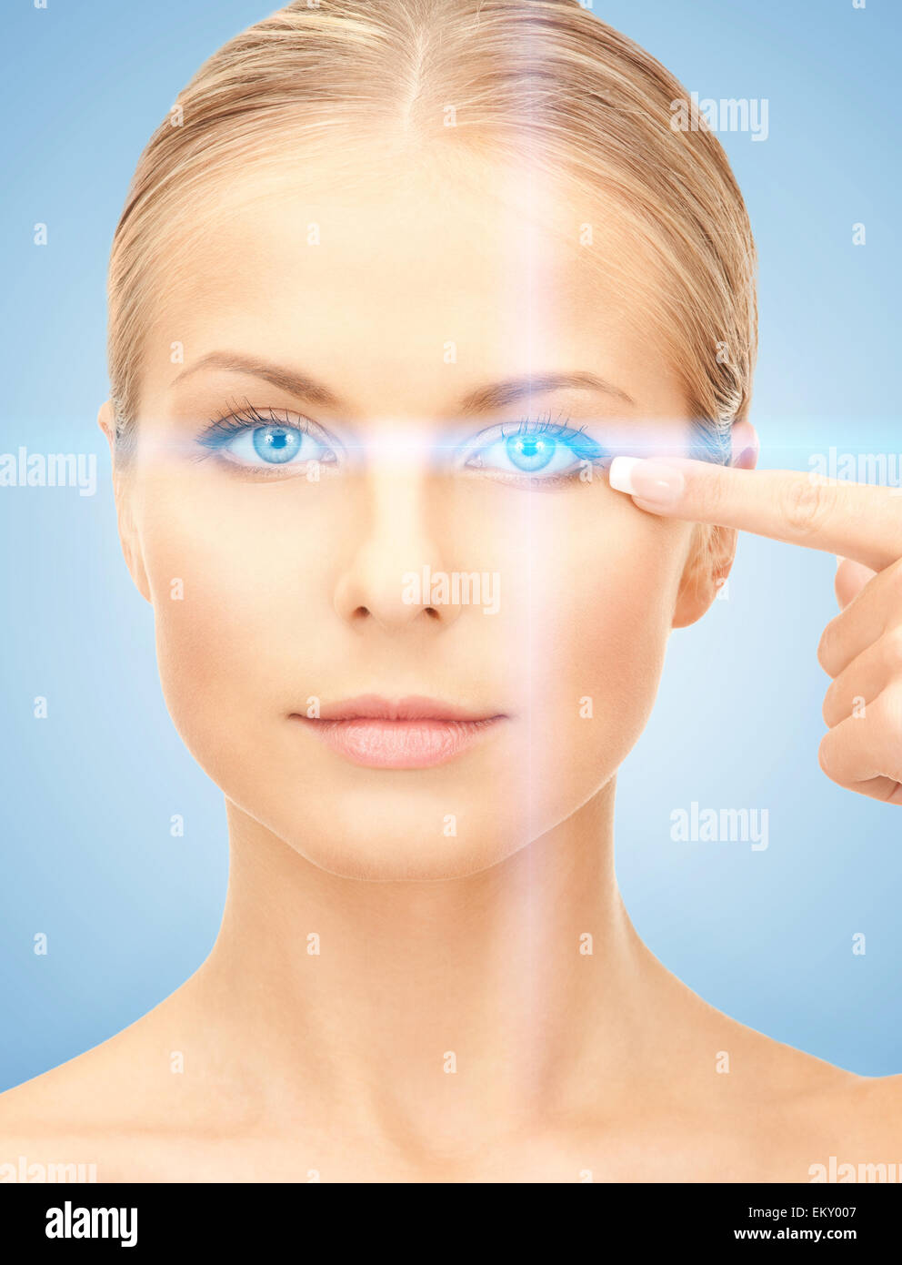 beautiful woman pointing to eye Stock Photo - Alamy