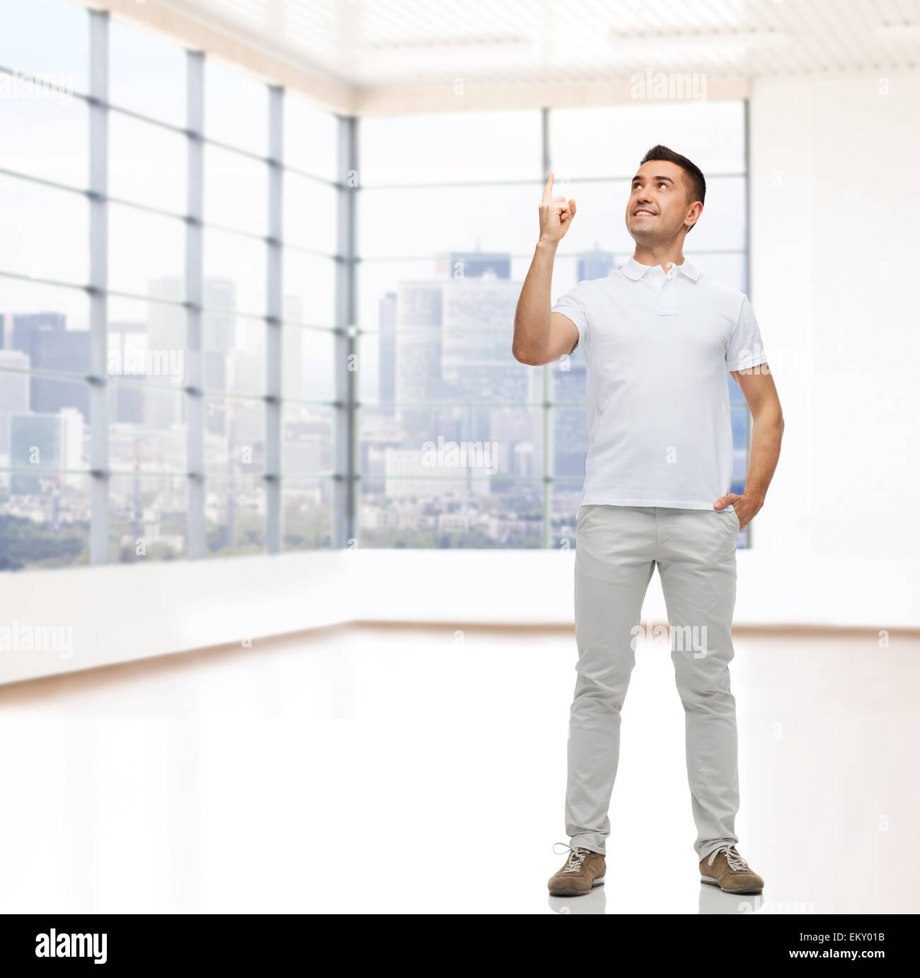 smiling man pointing finger up Stock Photo - Alamy smiling man pointing finger up Stock Photo - Alamy