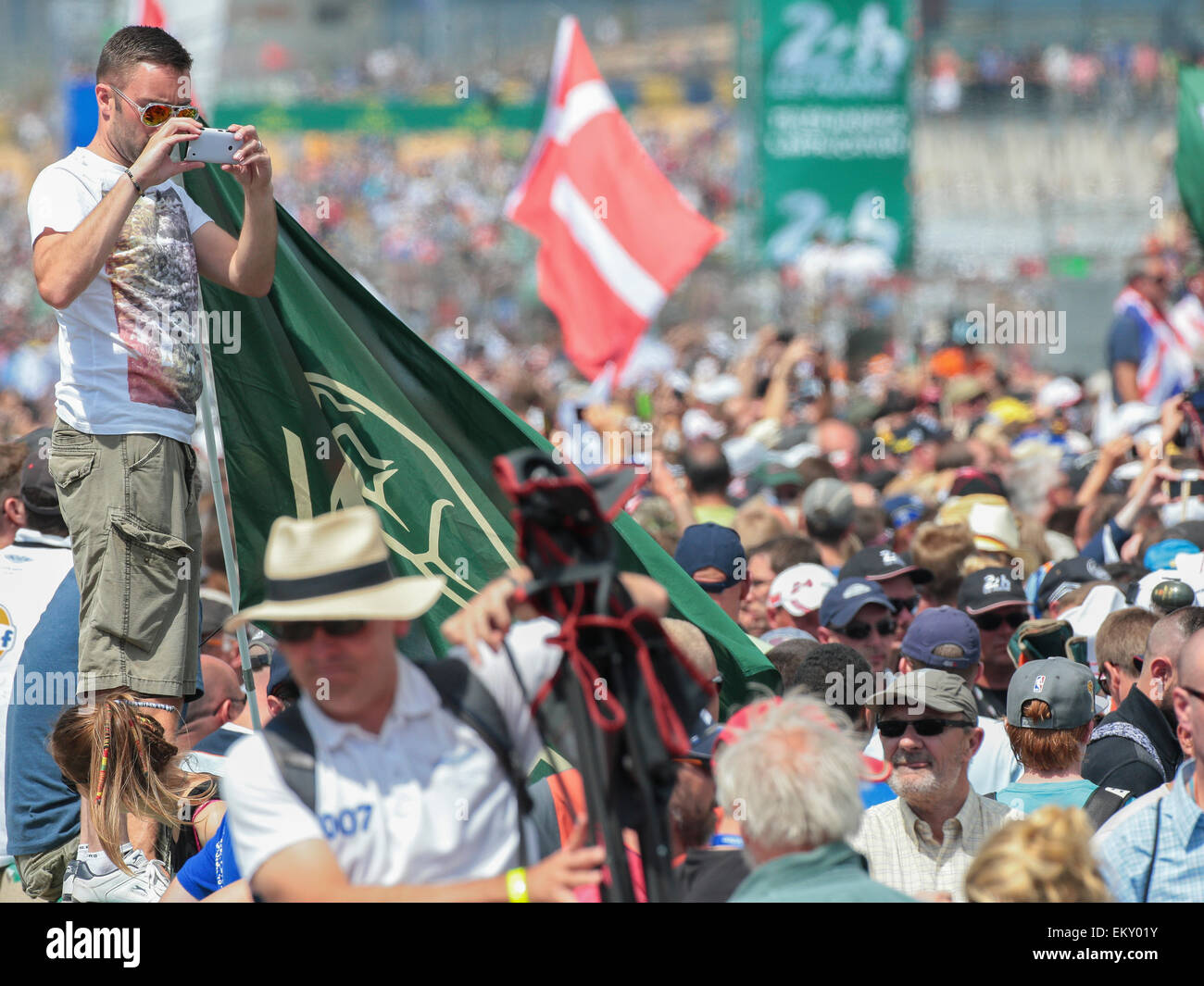LE MANS, FRANCE - JUNE 15, 2014: Fans celebrate the winners of the 24 ...