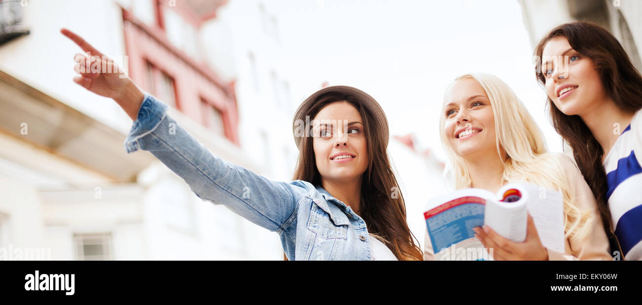 beautiful girls looking for direction in the city Stock Photo - Alamy