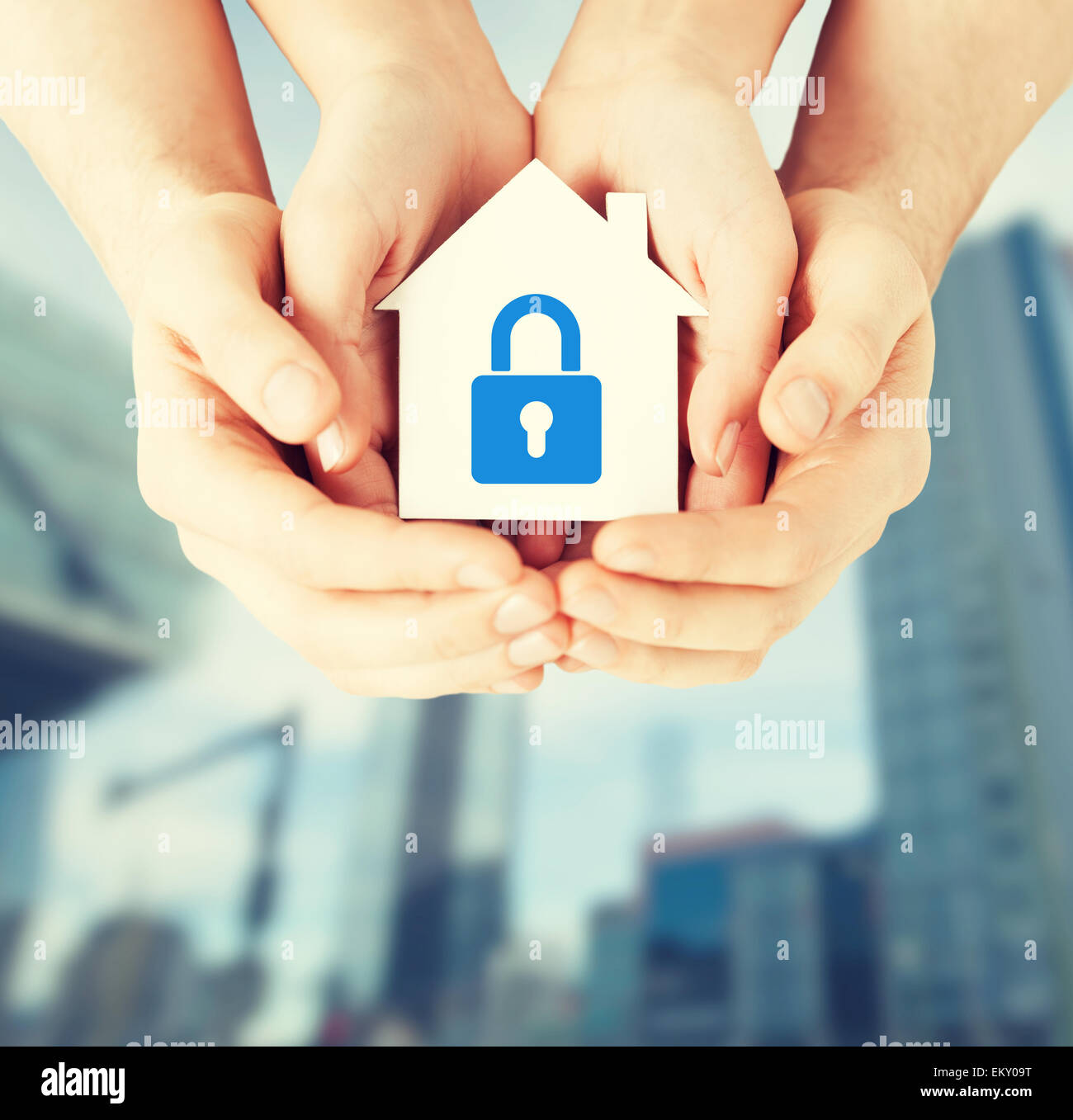 hands holding paper house with lock Stock Photo - Alamy