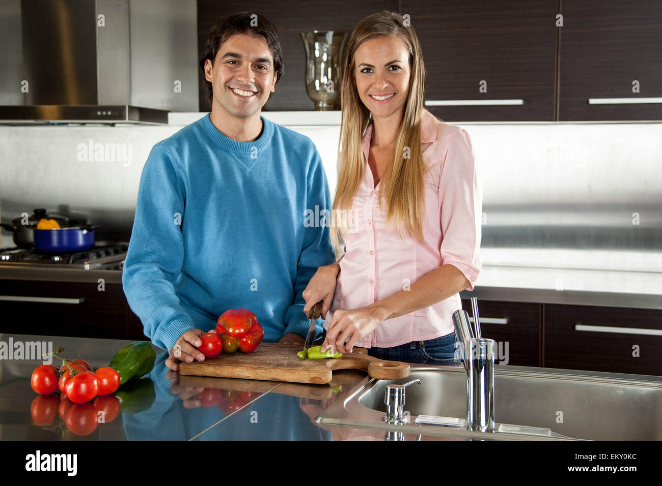 Couple in the kitchen Stock Photo - Alamy