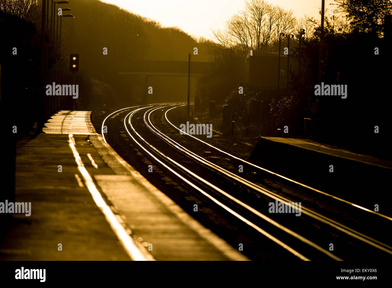 Reflection on train tracks at a station in Sussex, UK Stock Photo - Alamy