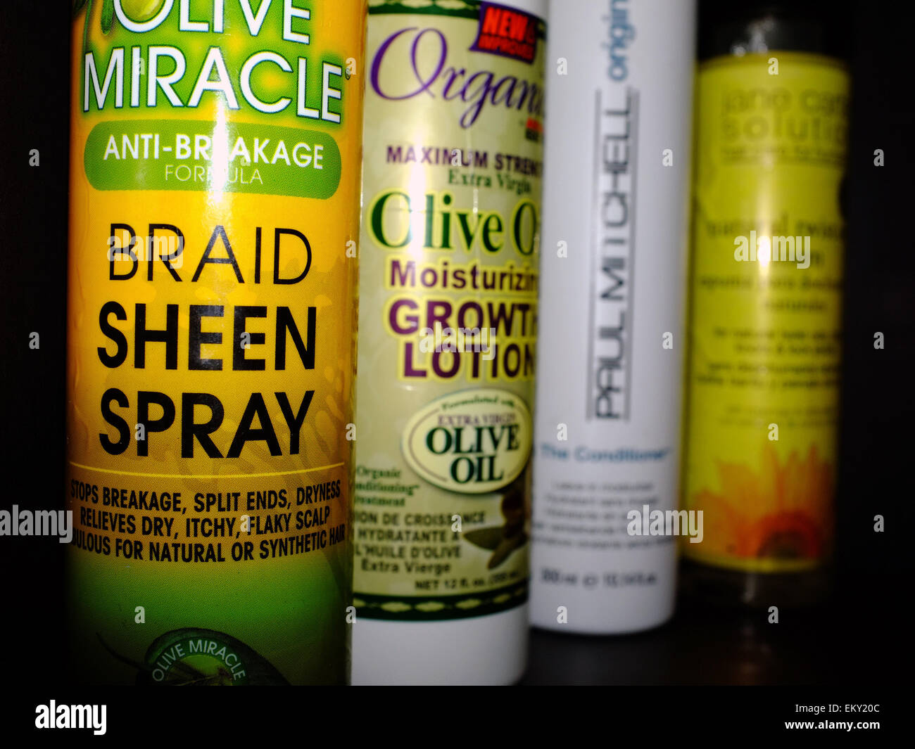 Black hair natural products photographed against a black background ...