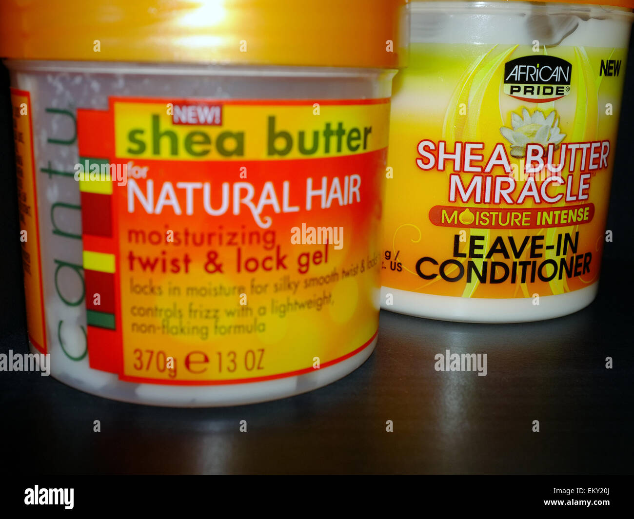 Black hair natural products photographed against a black background ...