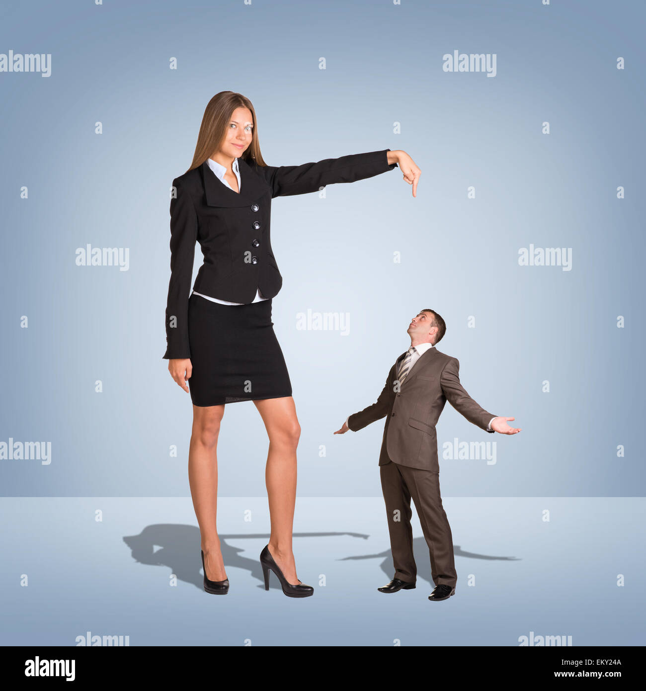 Tall businessman looking down short hi-res stock photography and images ...