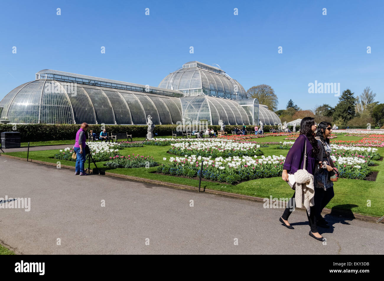 People enjoying sunny spring weather in front of the Palm House at the ...