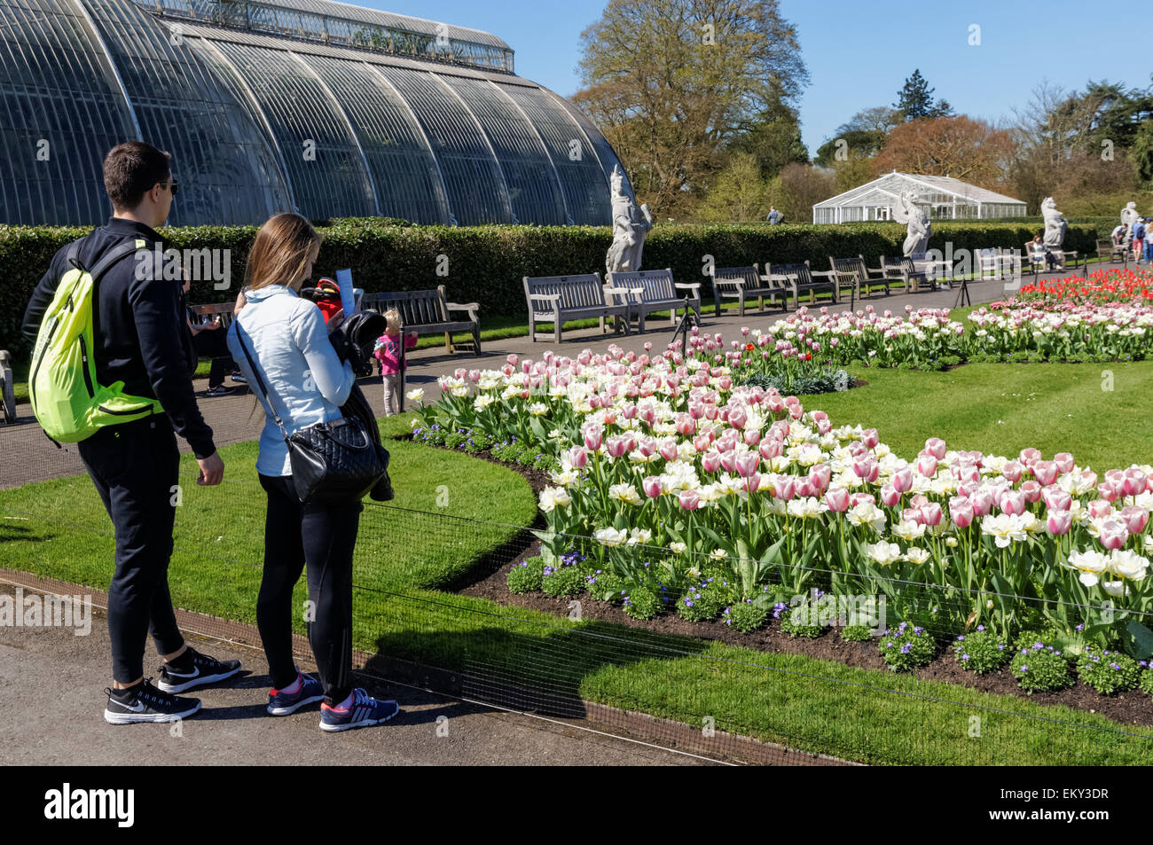 People enjoying sunny spring weather in front of the Palm House at the ...