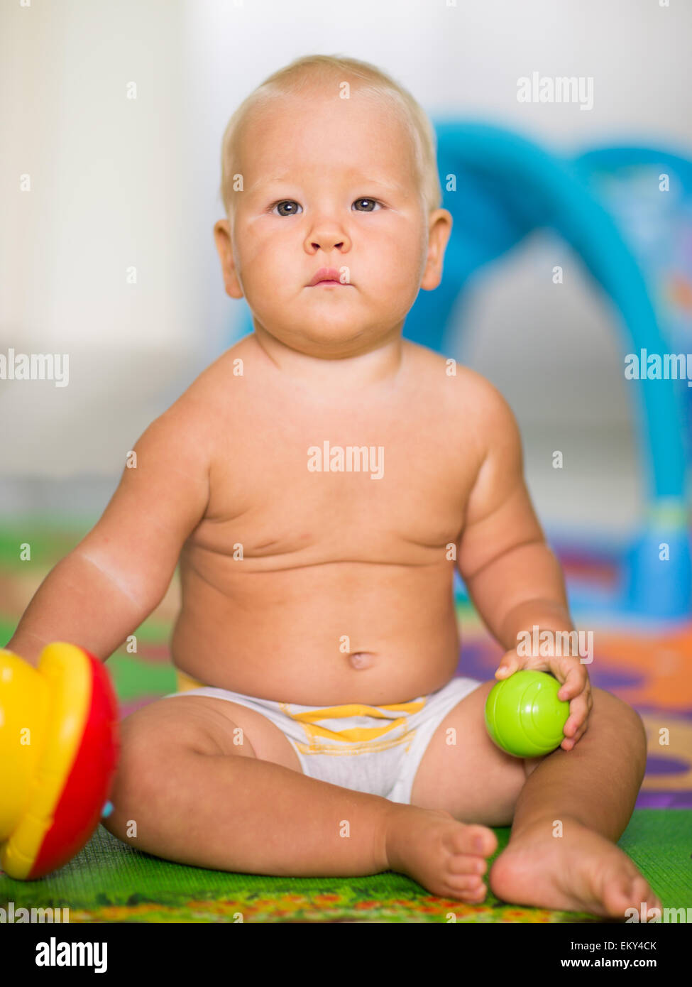 Infant playing hi-res stock photography and images - Alamy