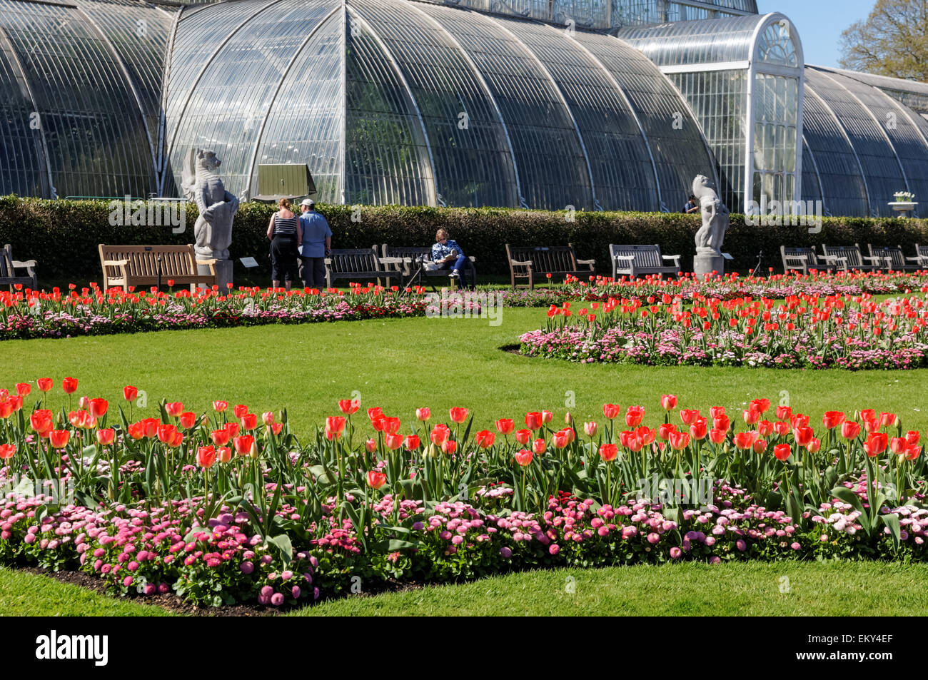 People enjoying sunny spring weather in front of the Palm House at the ...