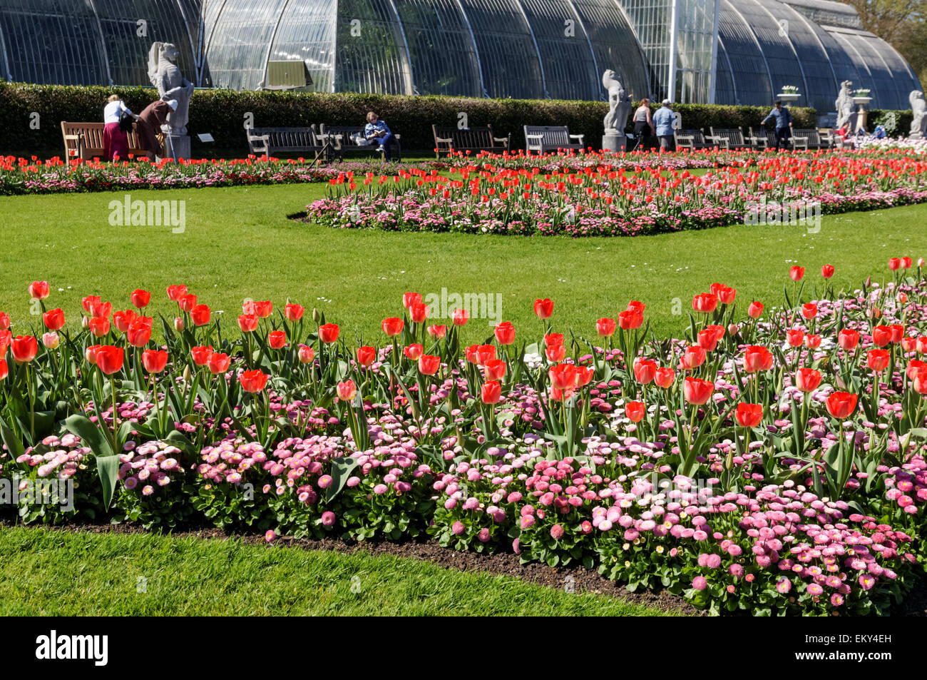 People enjoying sunny spring weather in front of the Palm House at the ...