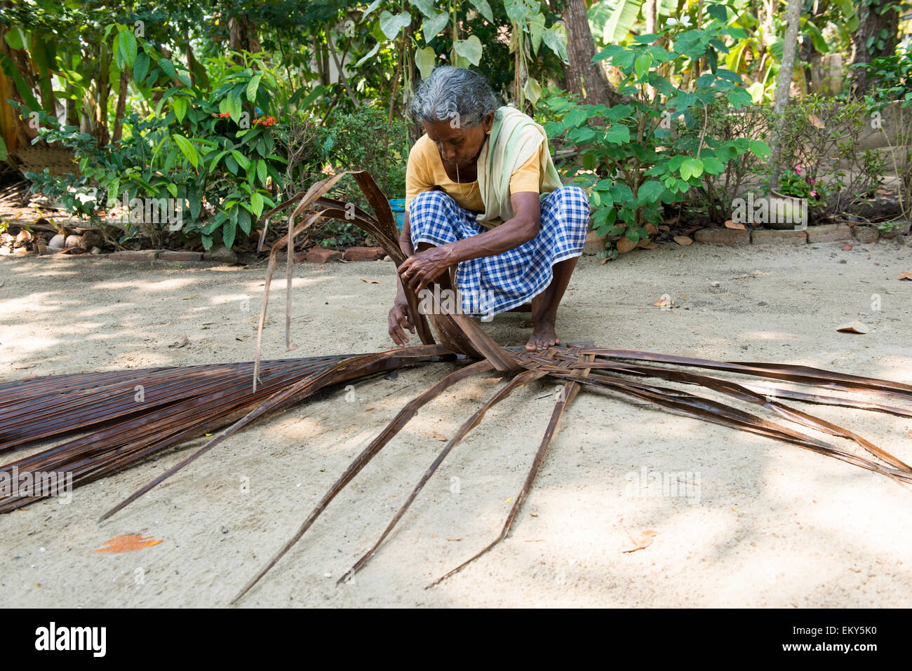 Woman weaving mat hi-res stock photography and images - Alamy