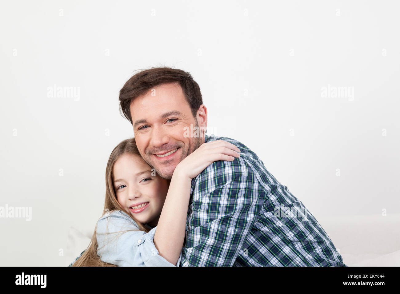 Man hugging his child Stock Photo - Alamy