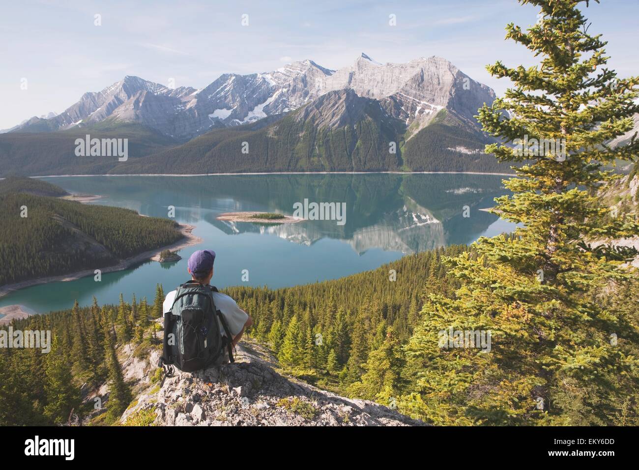 Kananaskis Country, Alberta, Canada; A Male Hiker Sitting On A Rock ...