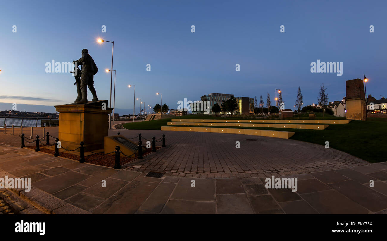Statues along a promenade and the River Tyne and sunset; South Shields ...