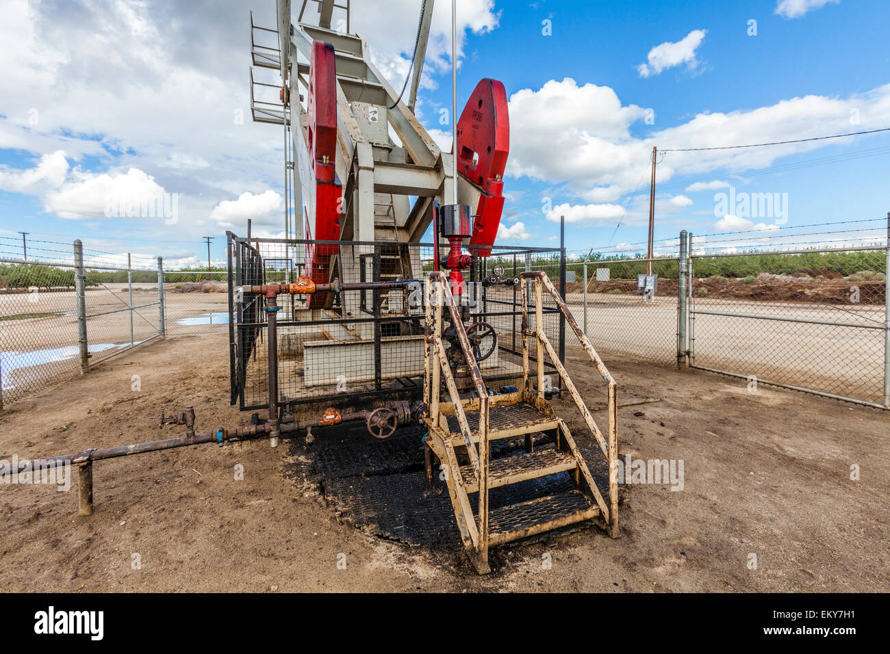 Water well being drilling next to oil well and fracking site in almond ...