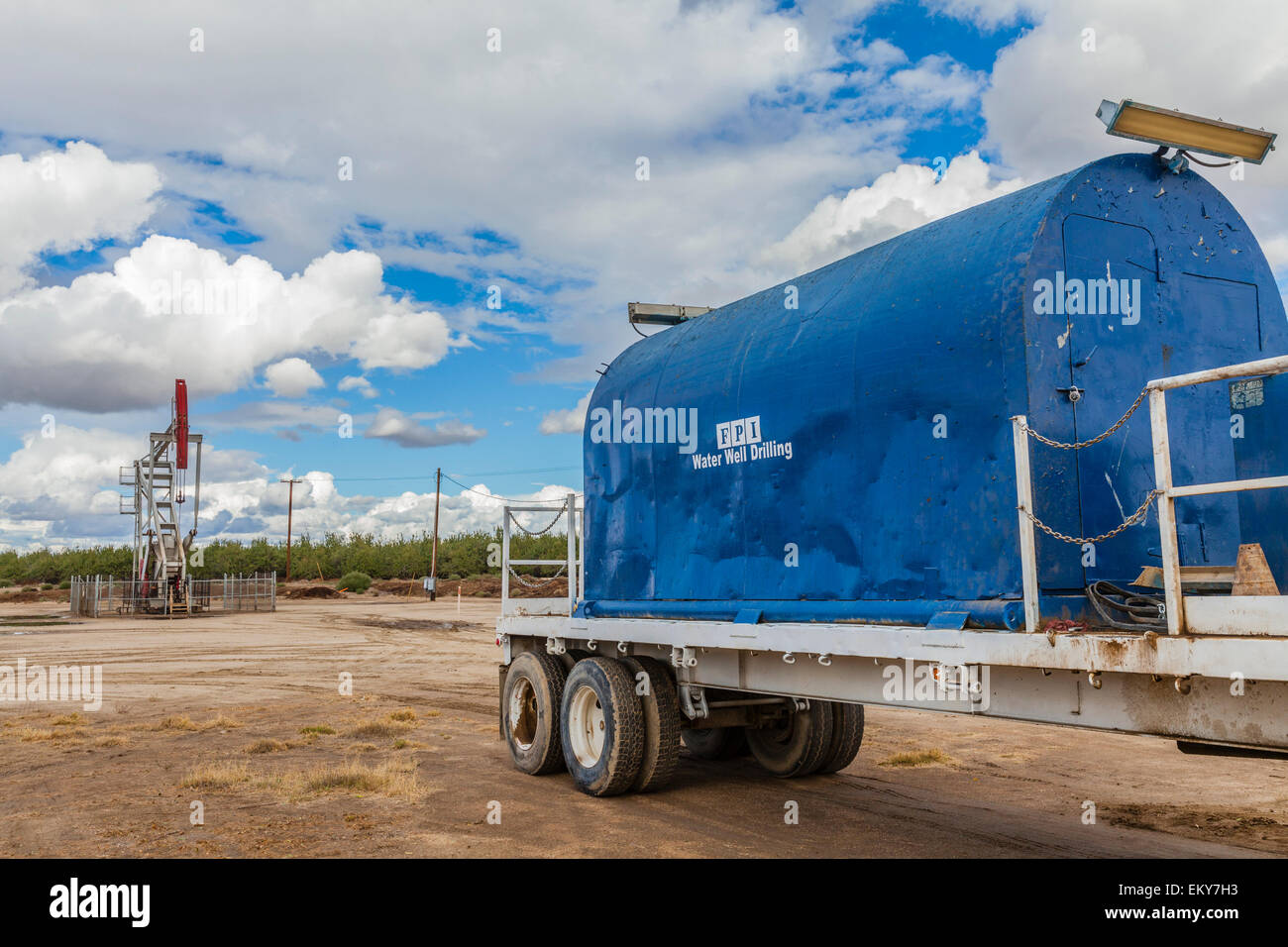 Water well being drilling next to oil well and fracking site in almond ...