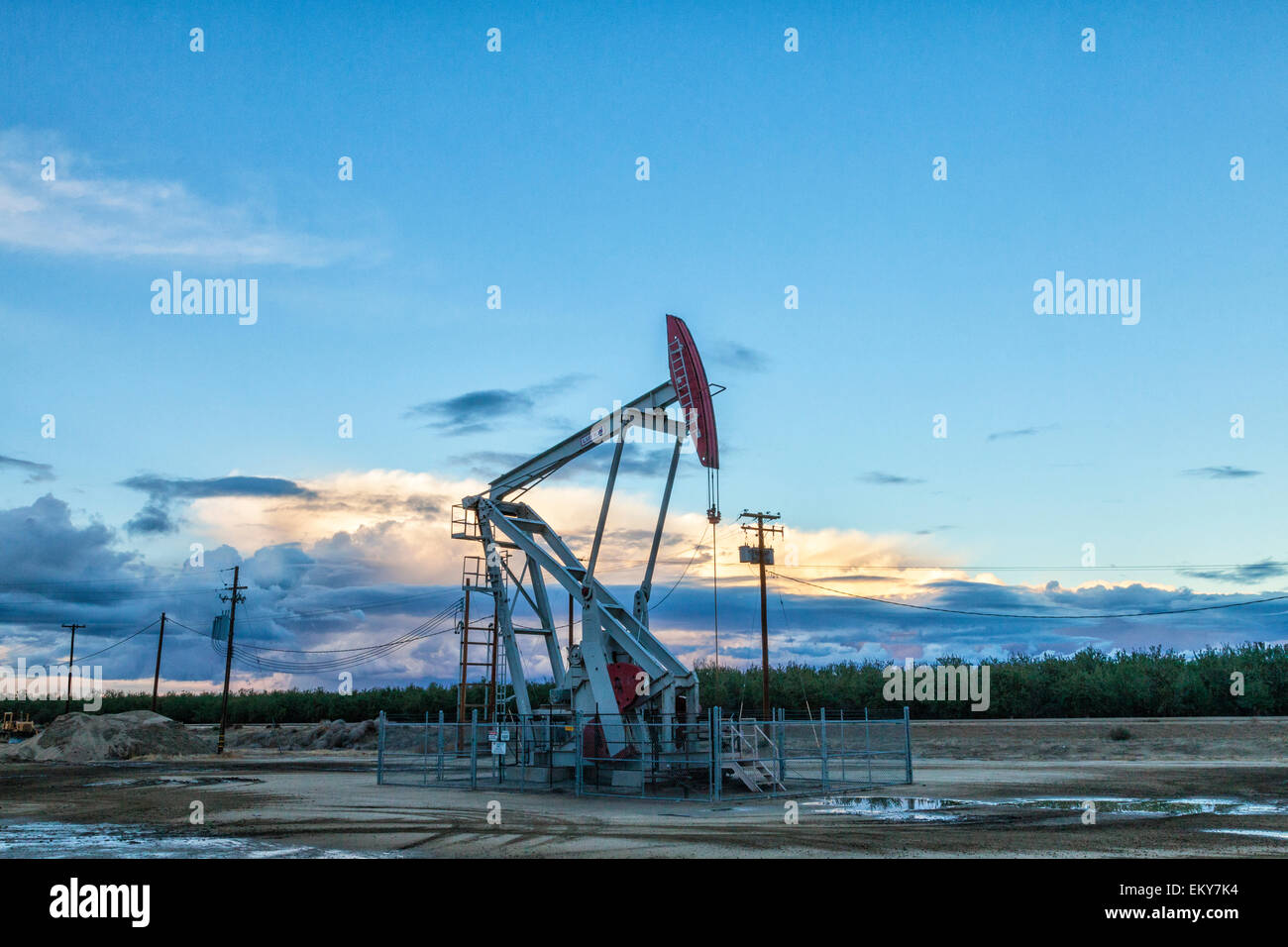 A pumpjack and surface water at oil well and fracking site in Shafter ...