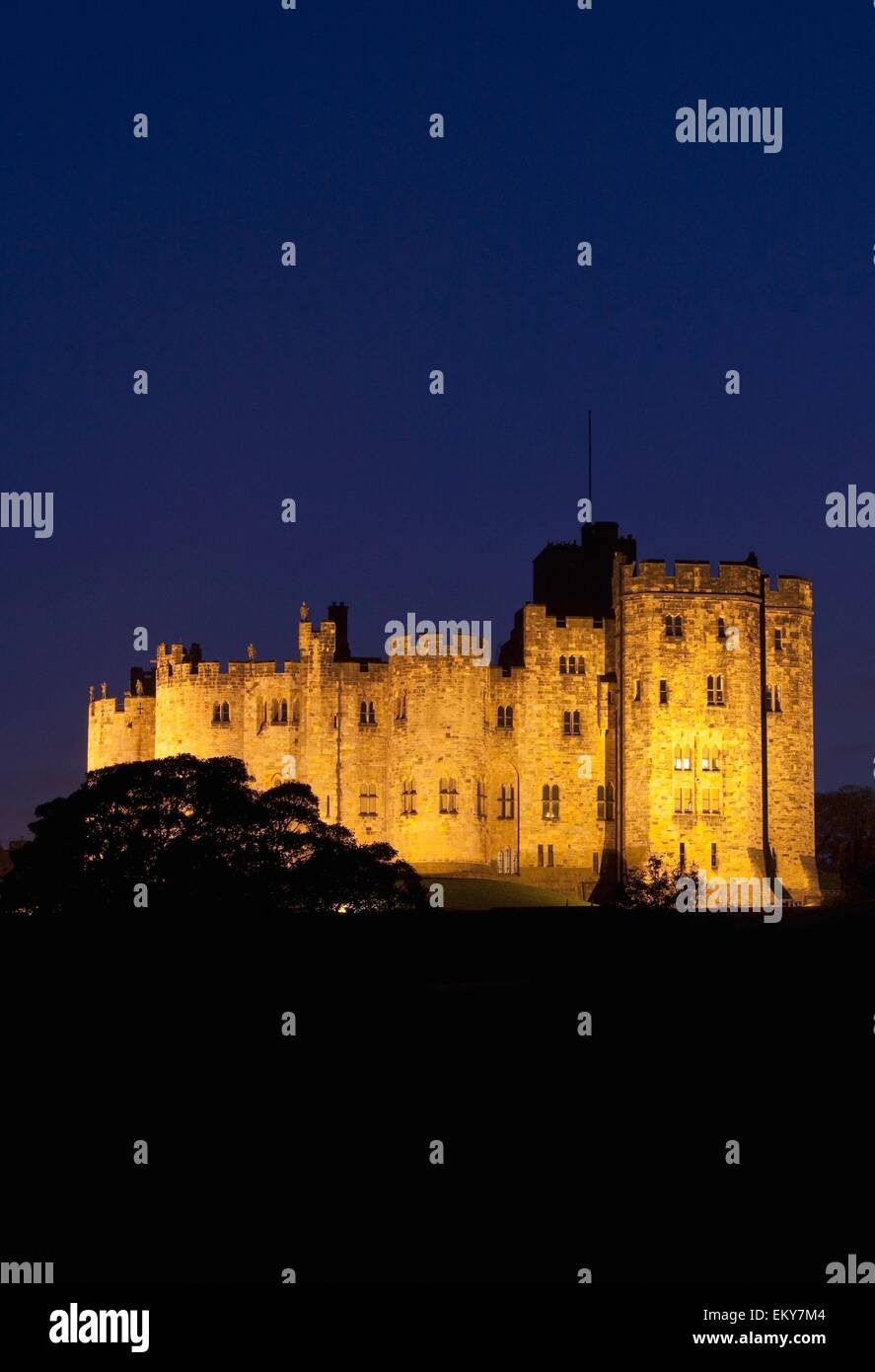 A Stone Building Illuminated At Night Stock Photo - Alamy