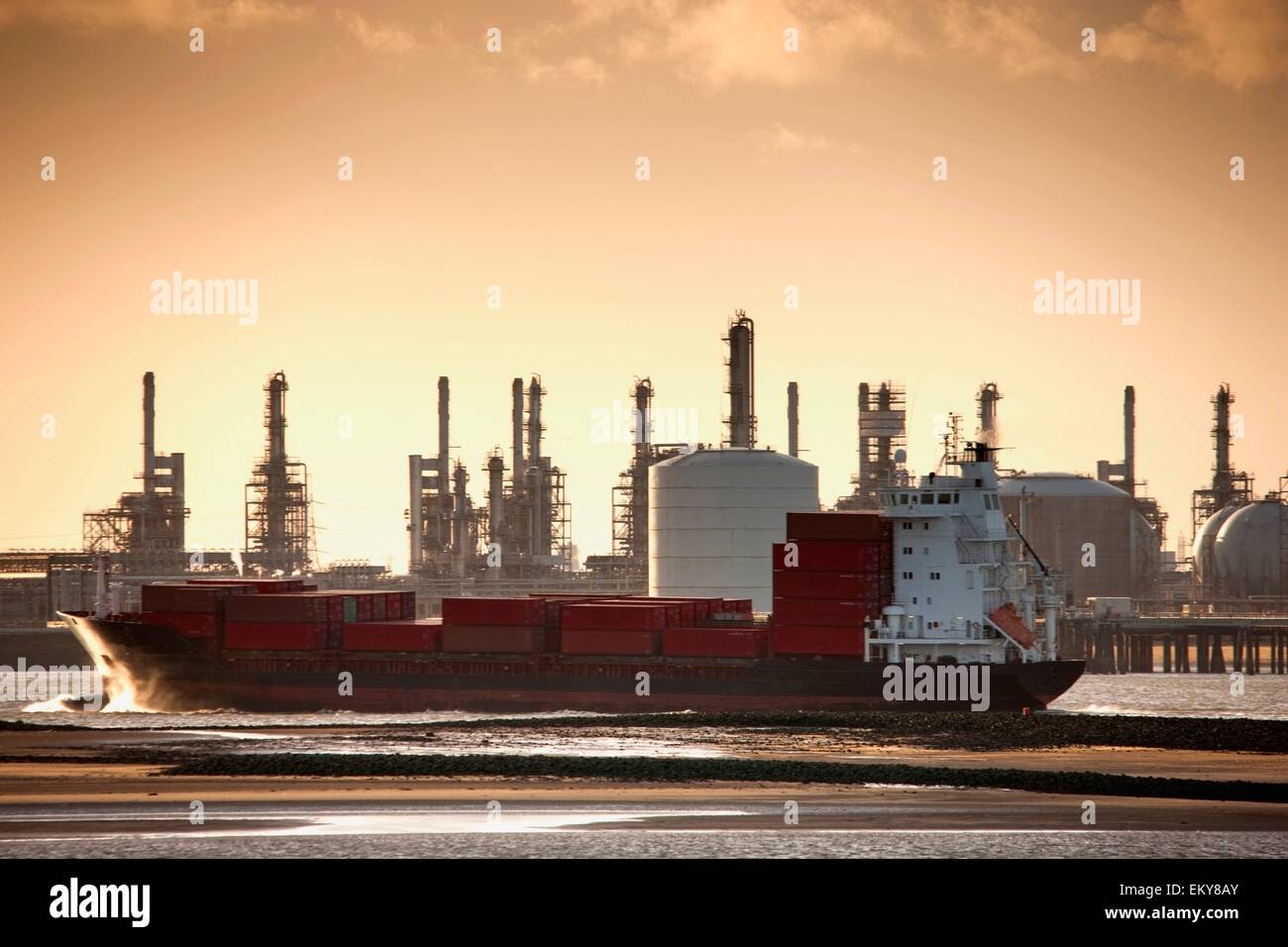 Teesside, England; A Boat In The Water With A Refinery In The ...