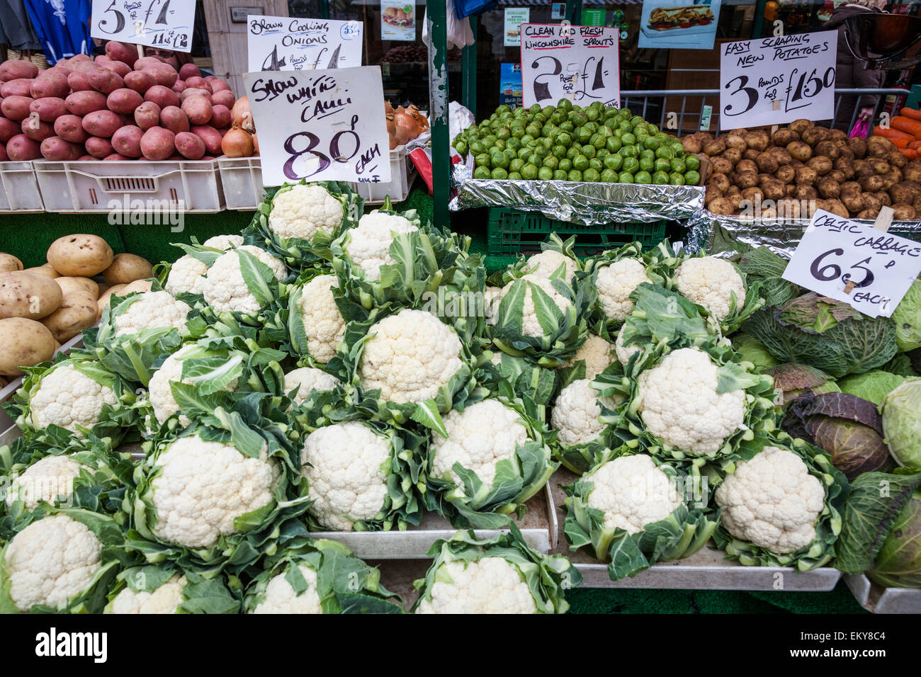 A display of cauliflowers take pride of place on a vegetable market ...